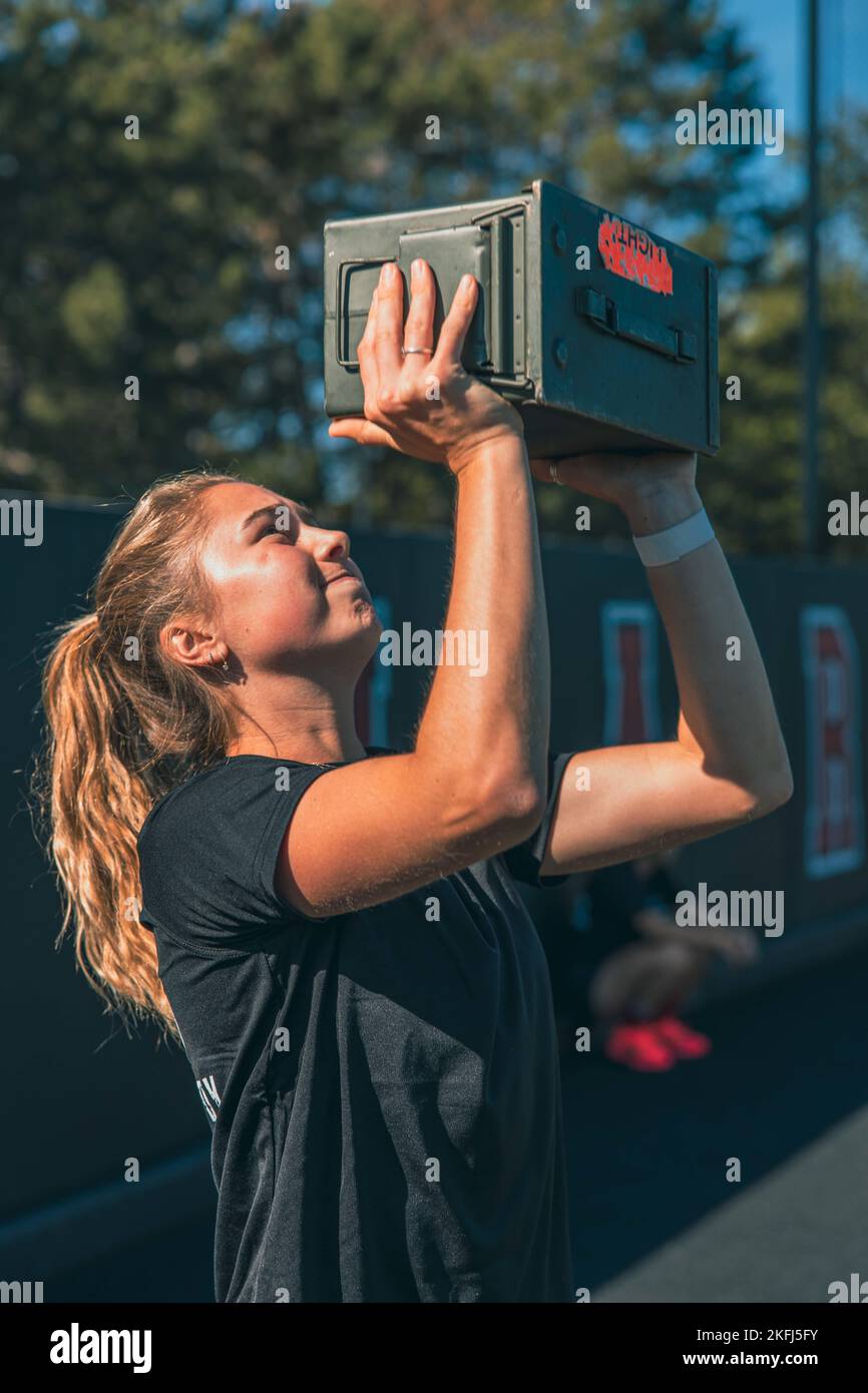 A member of Harvard University’s field hockey team conducts the ammo ...