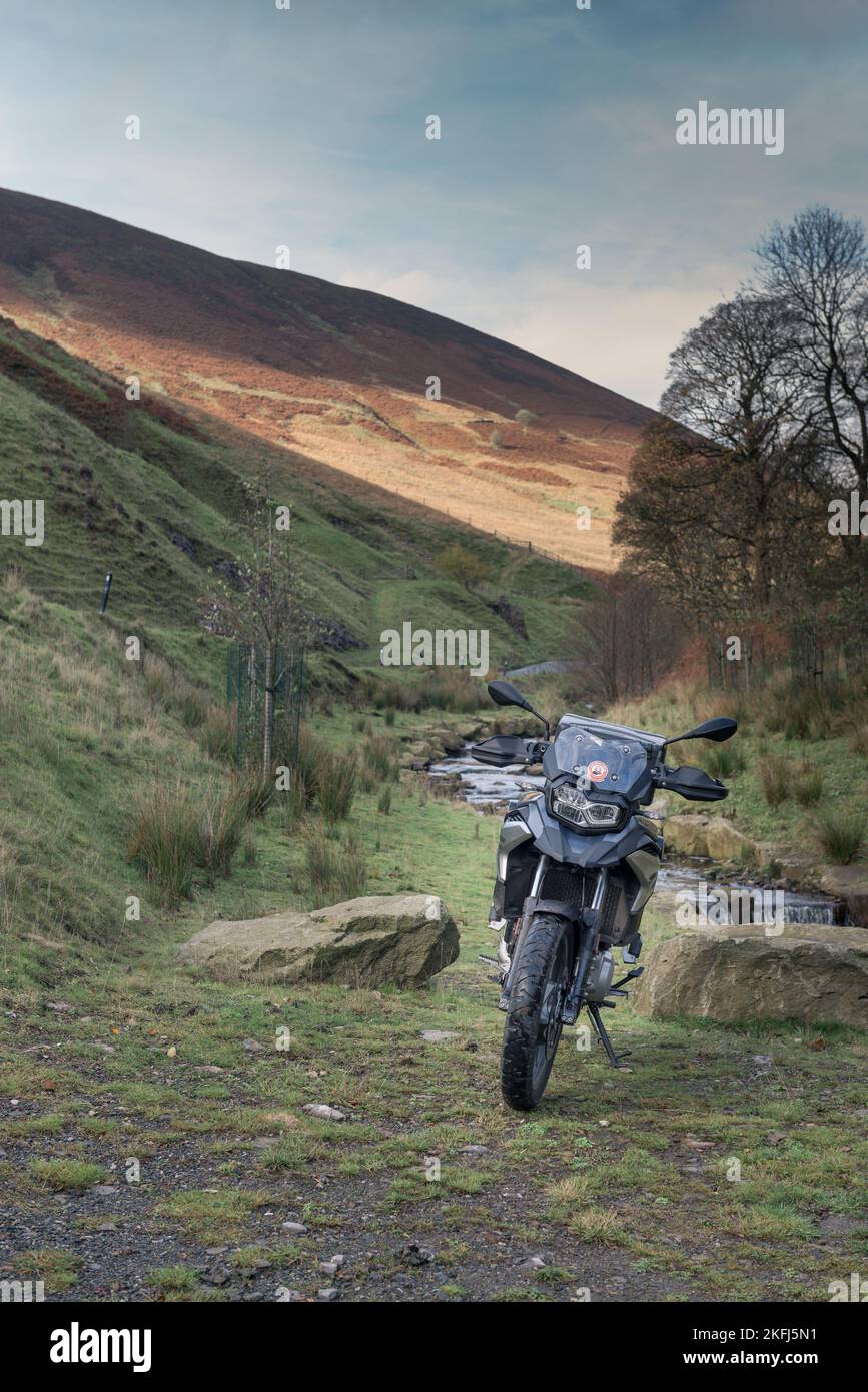 BMW F750GS motorcycle parked in the countryside. Autumn leaves and ...
