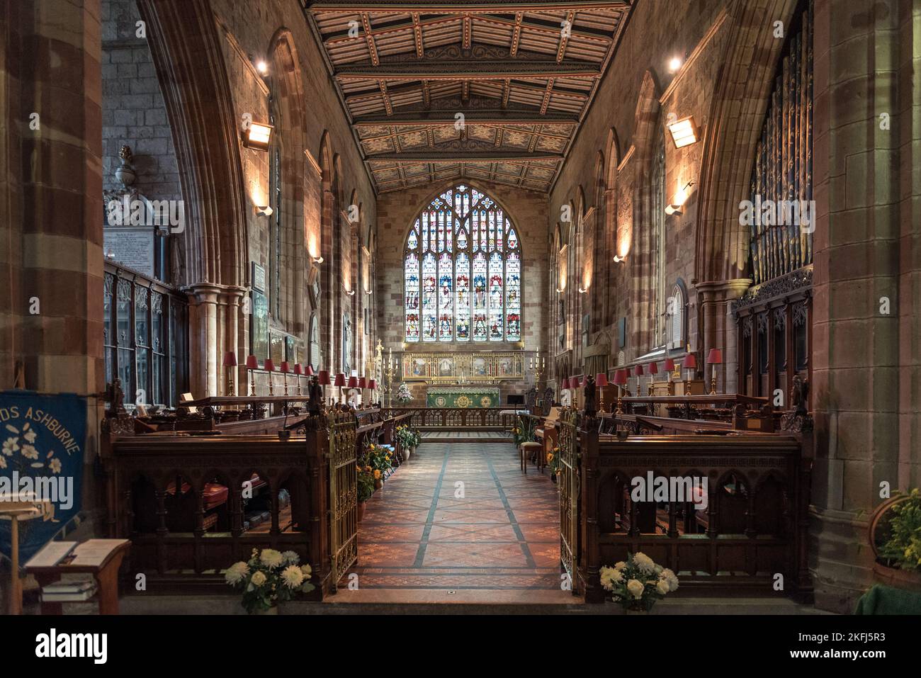 St Oswalds Church, Ashbourne, Derbyshire, UK. Alter and beautiful stain ...