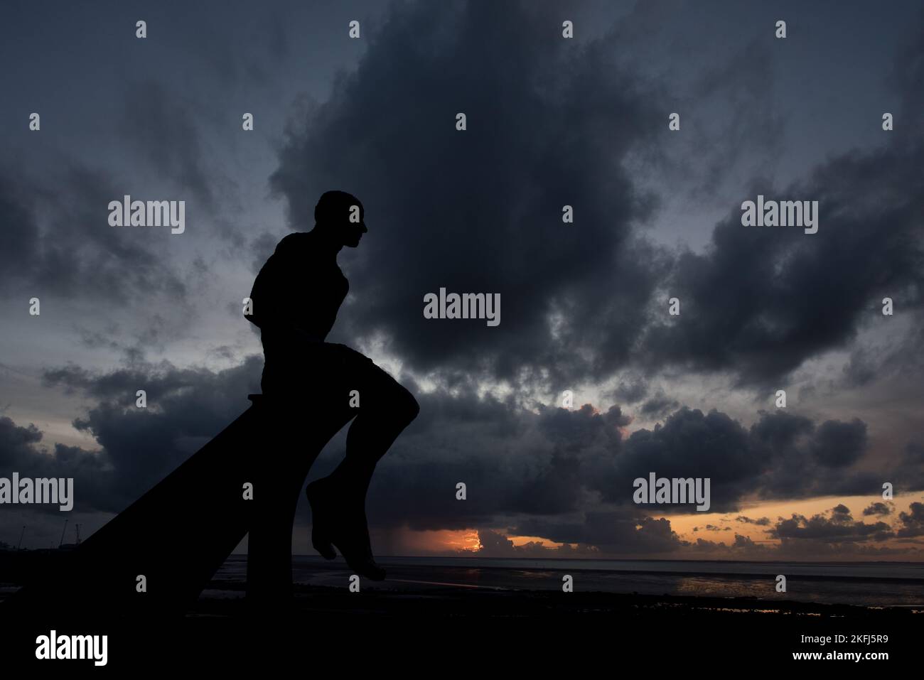 Amazing sunset with stunning moody grey clouds in the sky. Half moon ...