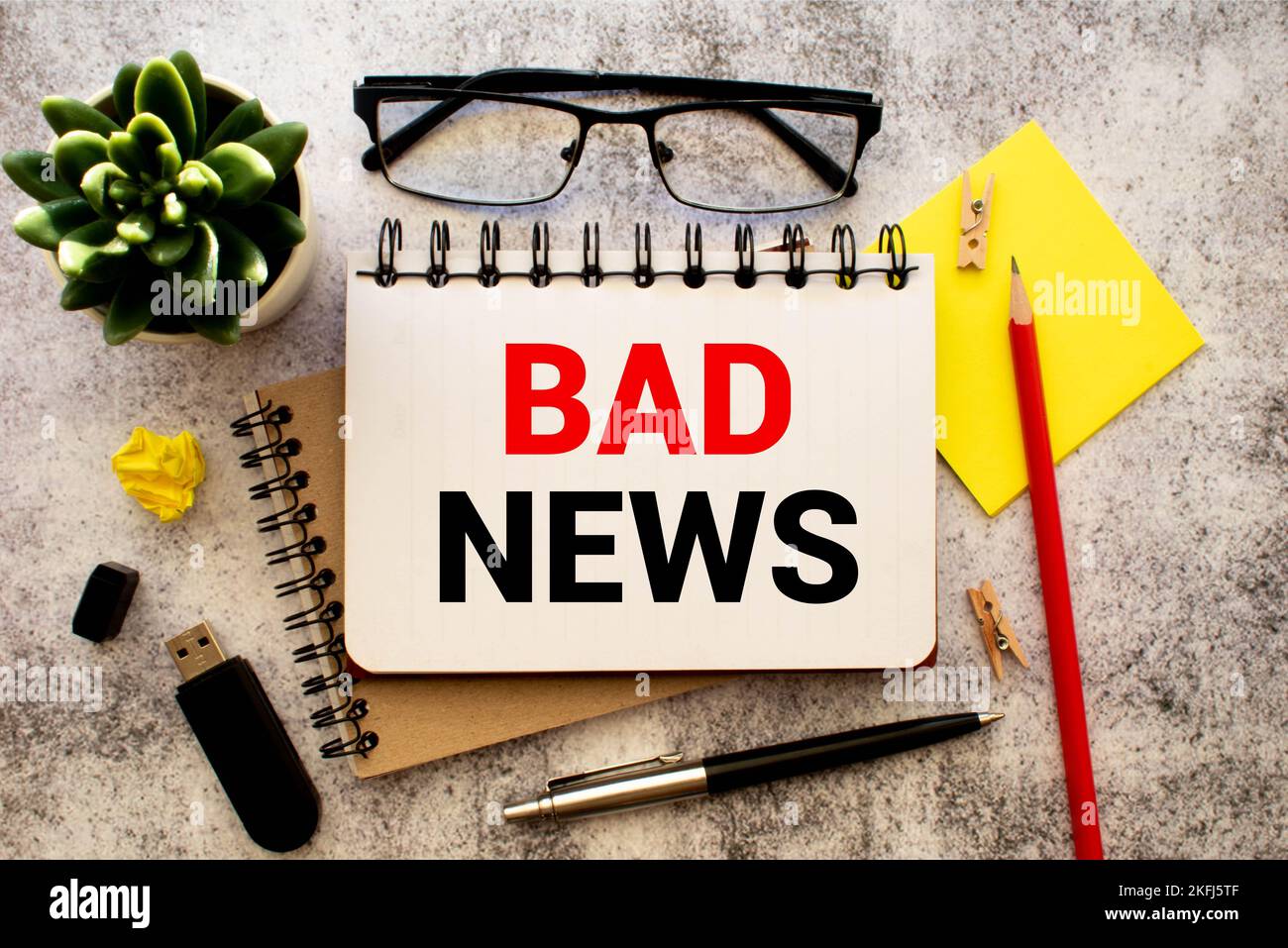 Bad News, Newspaper roll with white background Stock Photo - Alamy