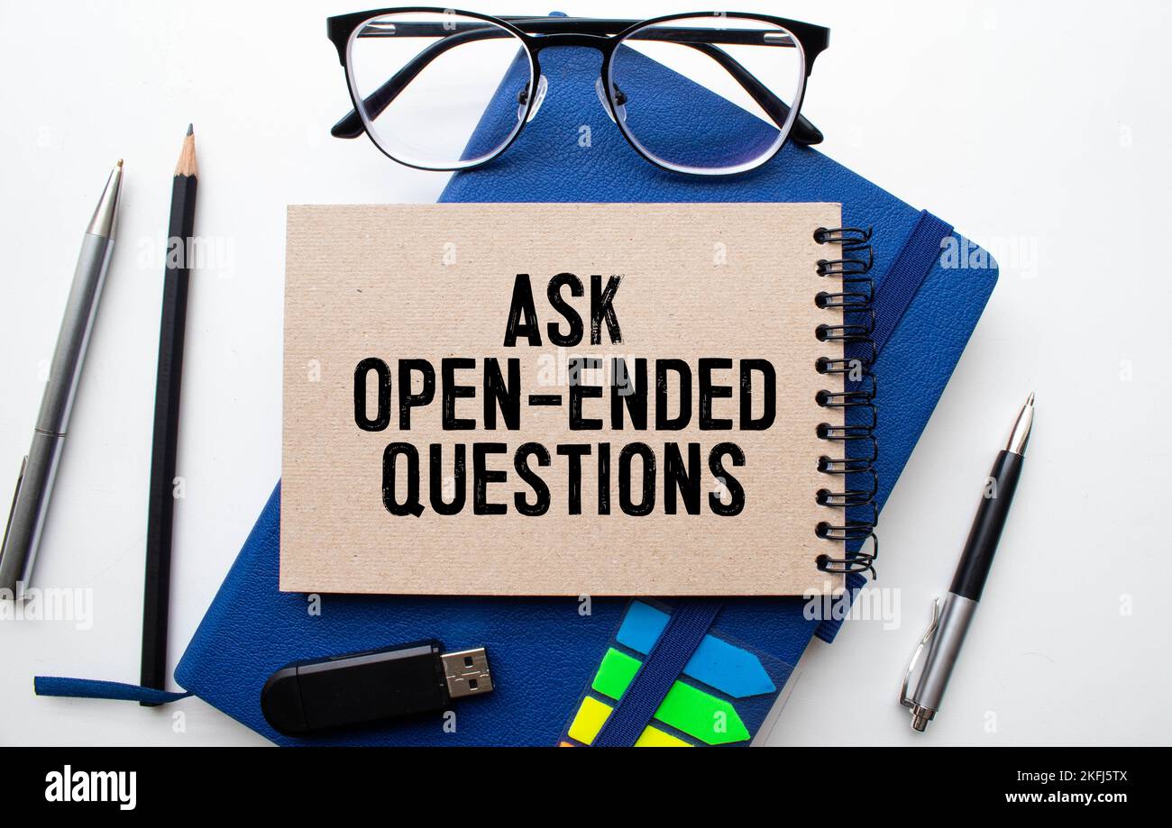 Ask Open-Ended Questions written on a notebook page, pencil on the left ...