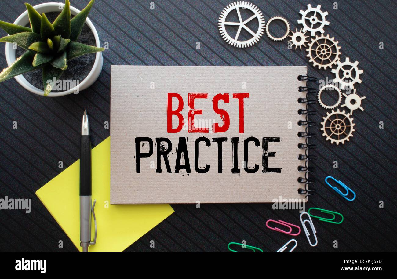 BEST PRACTICE on brown clipboard on the grey background. Business ...