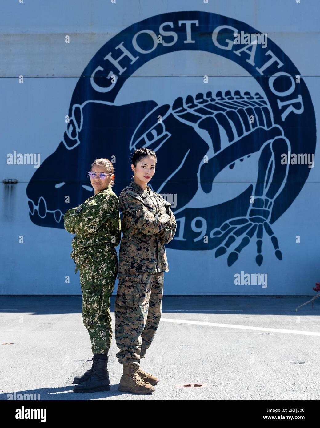 U.S. Marine Corps Lance Cpl. Charisse Briguera, right, a rifle Marine ...