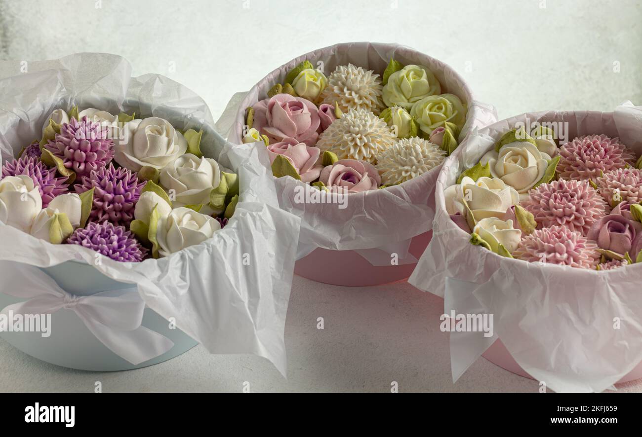 Zephyr bouquet of flowers in a gift box on a light background ...