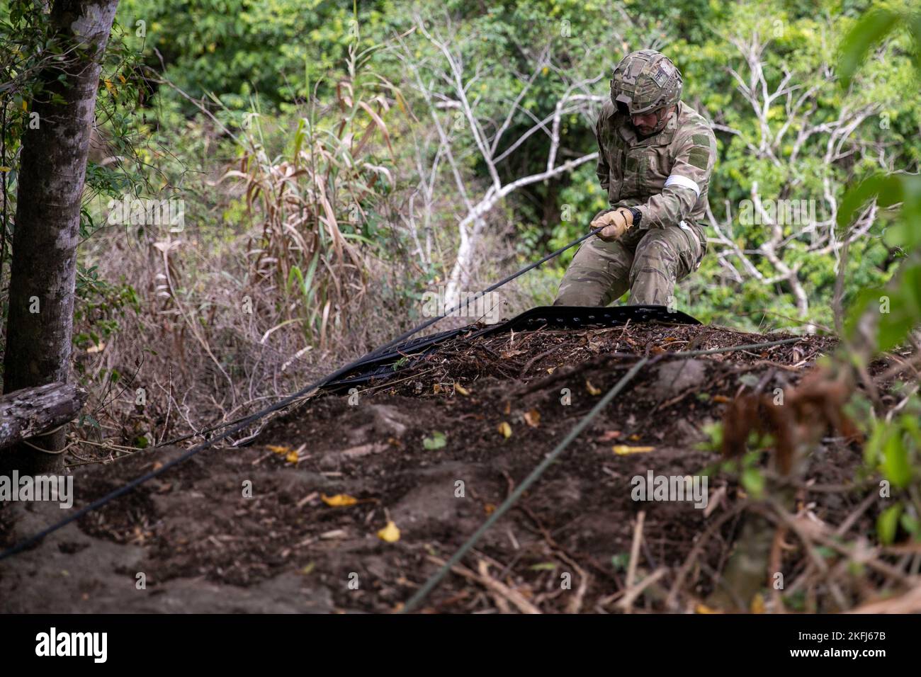 A Soldier from the New Zealand Army goes over the cliff face during ...