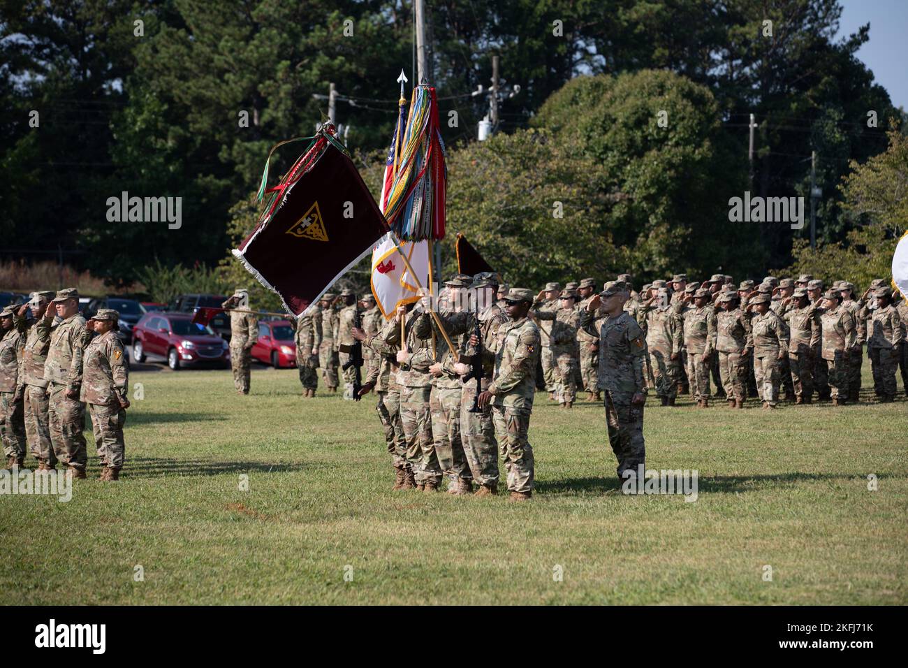 U.S. Army Soldiers raise their color guard flags during a change of ...