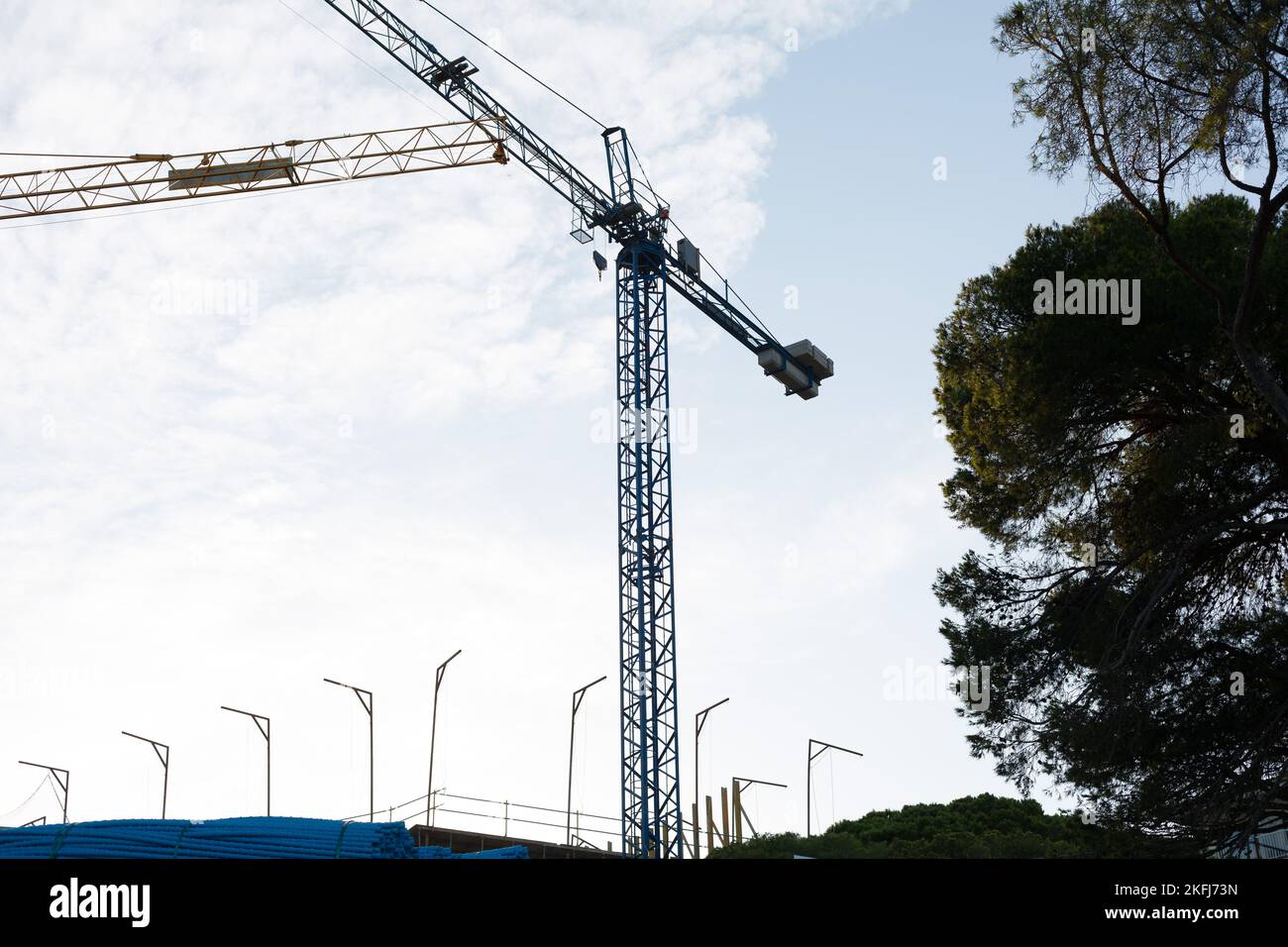 Crane lifting construction materials at site hi-res stock photography ...
