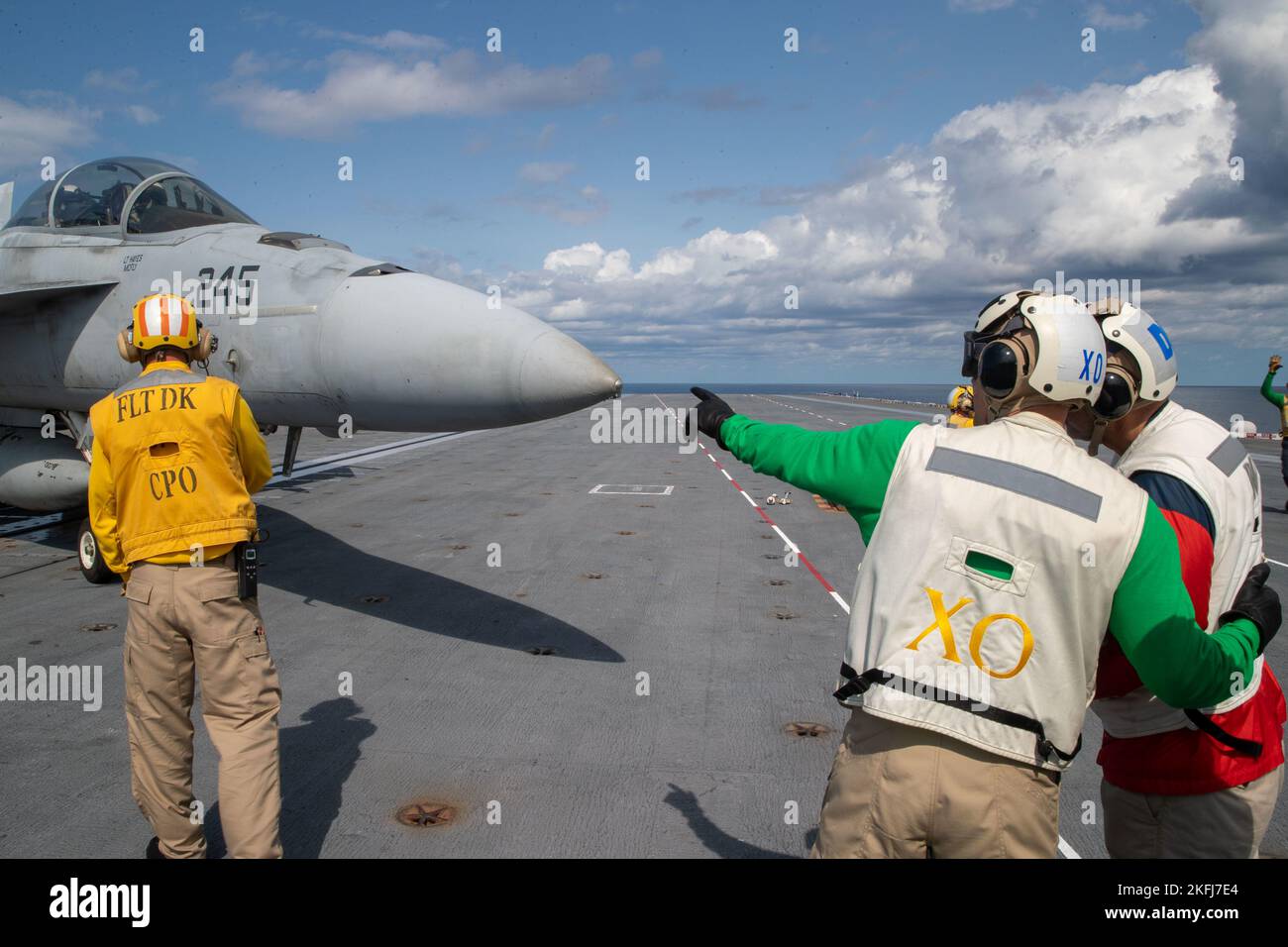 Capt. Jeremy Shamblee, center, the first-in class aircraft carrier USS ...