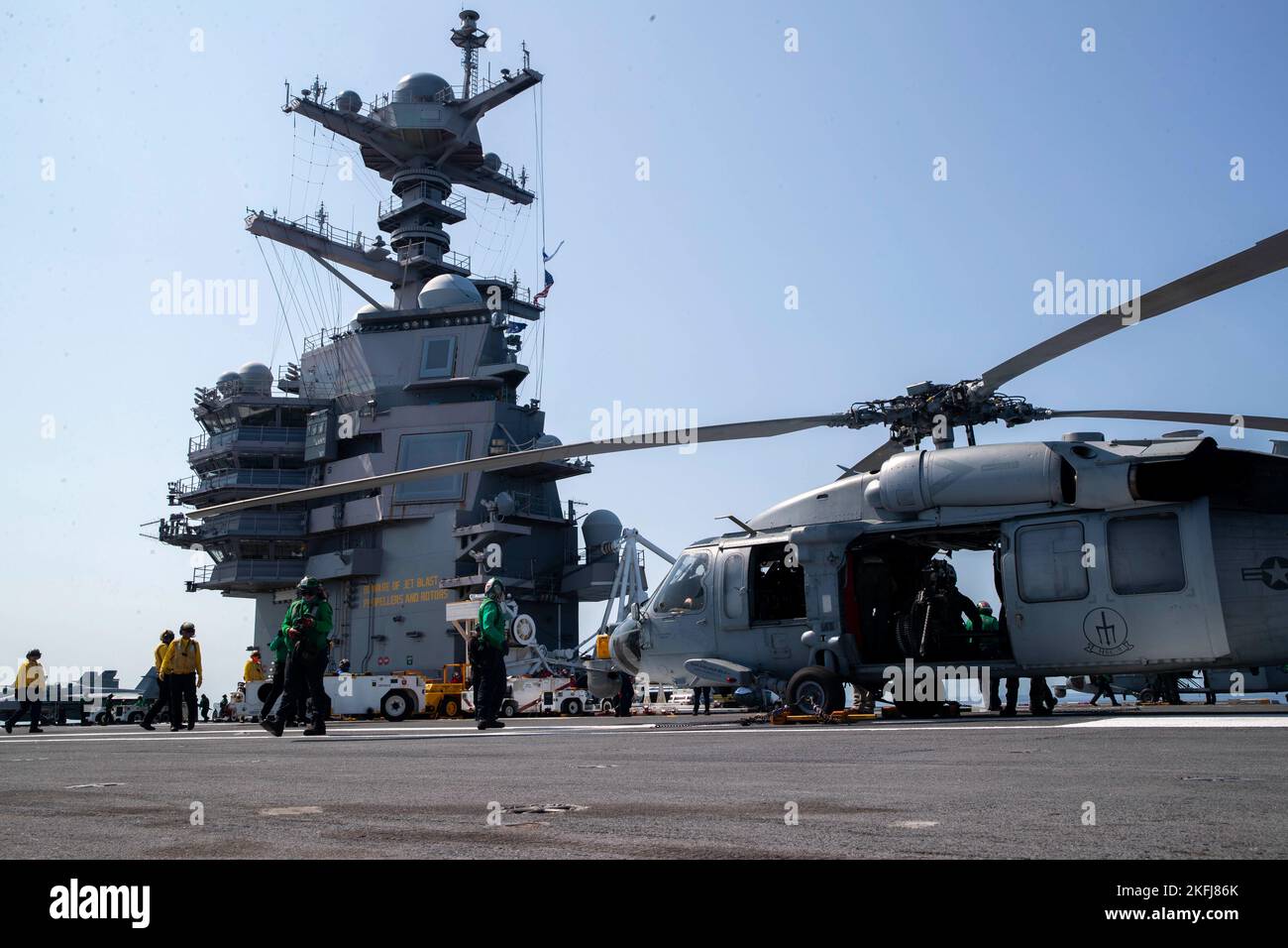 Sailors assigned to the first-in-class aircraft carrier USS Gerald R. Ford (CVN 78) prepare for ...