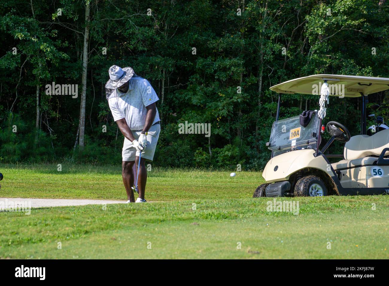 Steven Short, a motor transport specialist, strikes his ball on the ...