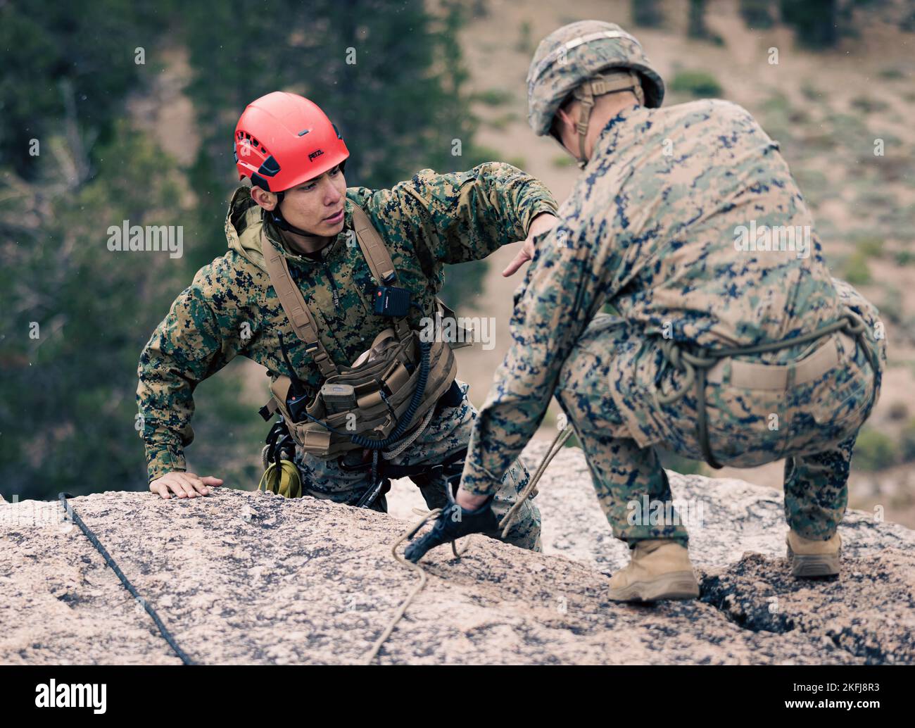 U.S. Marine Corps Sgt. Luis Aragon (Left), a mountain warfare ...