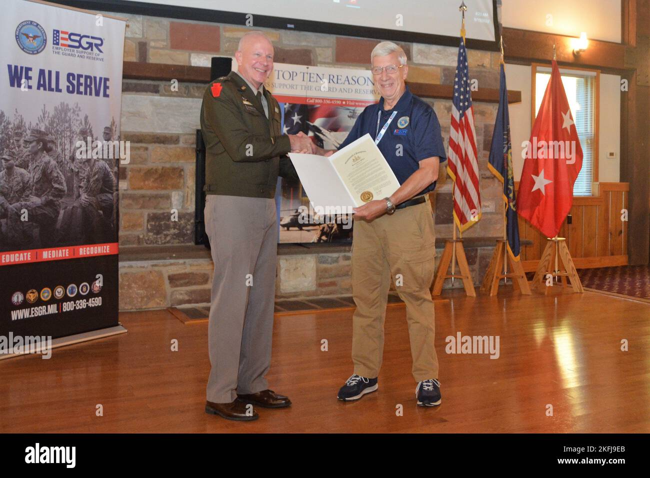 Pennsylvania Adjutant General Maj. Gen. Mark Schindler (left) presents ...