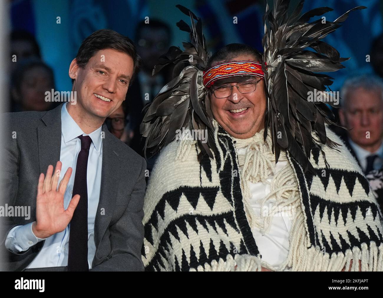 B.C. Premier David Eby, left, waves to his children as he sits with ...