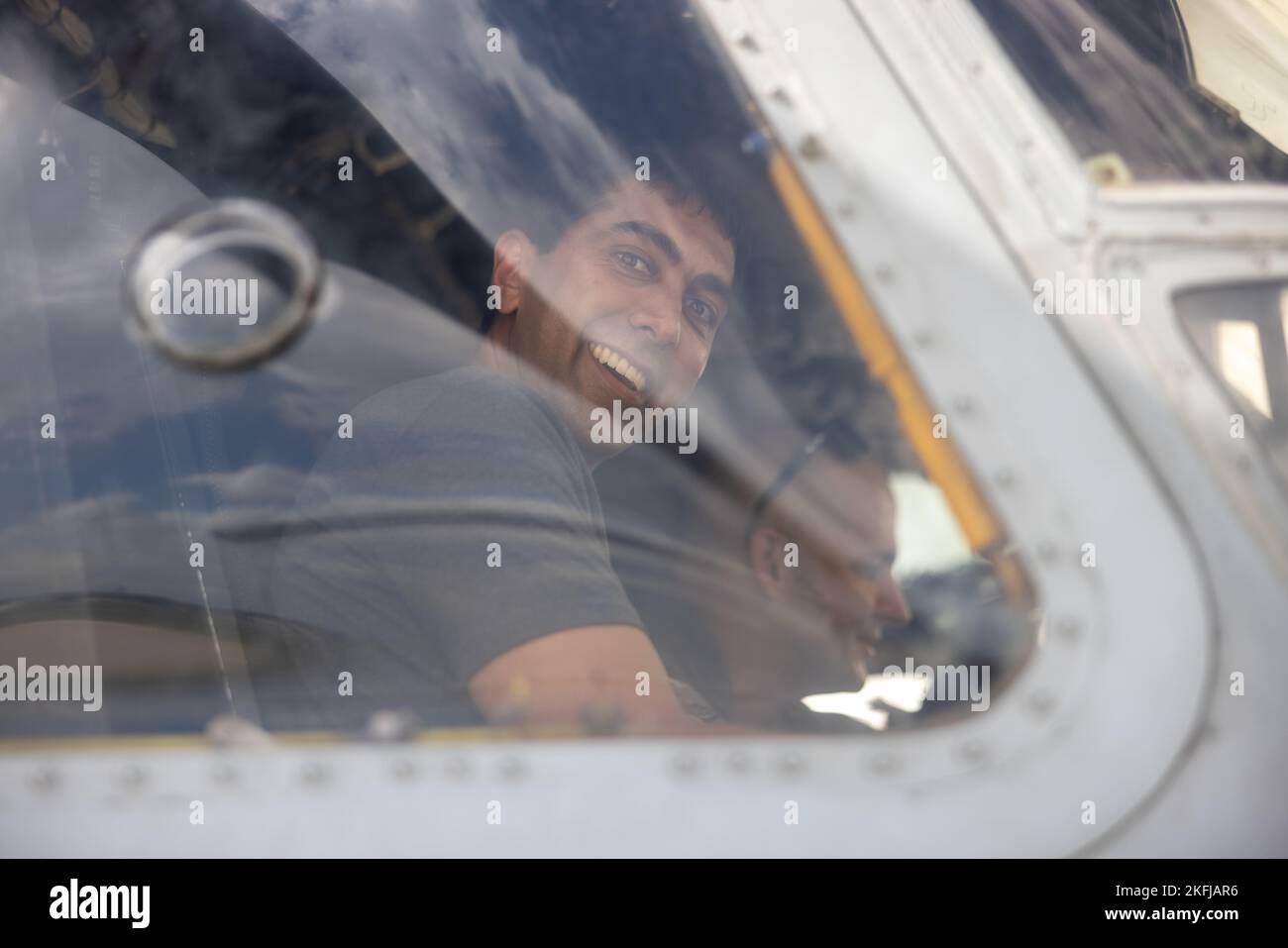 Members of the Defense Science Study Group receive a brief from a U.S ...