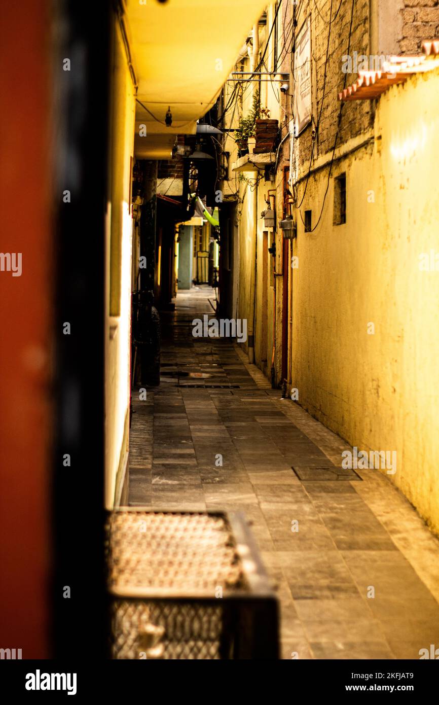 A narrow alley of a residential area, vertical shot Stock Photo - Alamy