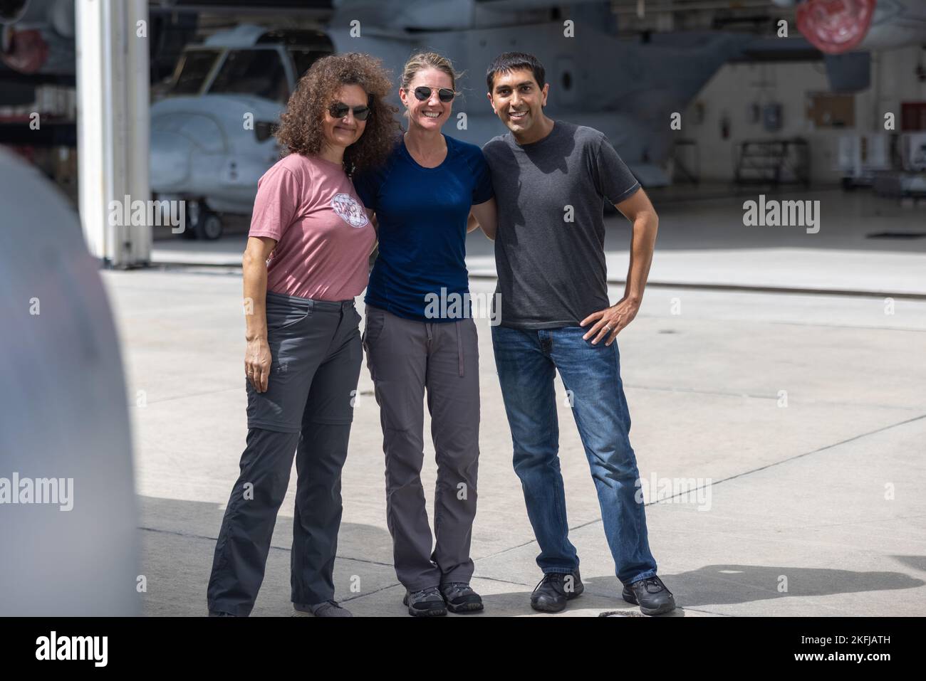 Members of the Defense Science Study Group pose for a picture next to a ...