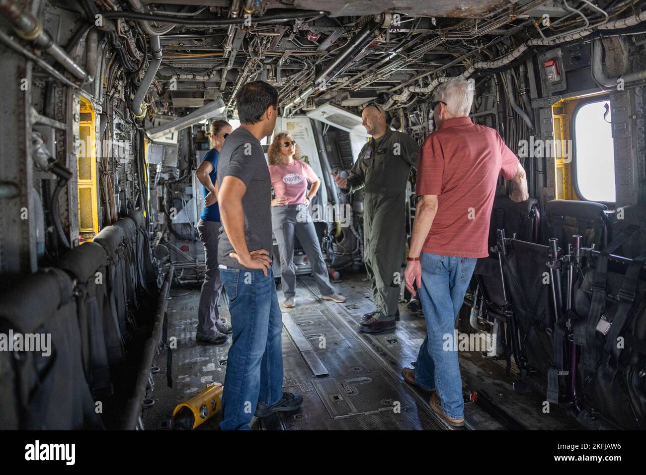 Members of the Defense Science Study Group receive a brief from a U.S ...