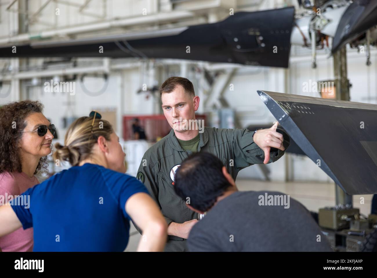 Members of the Defense Science Study Group receive a brief from a U.S ...