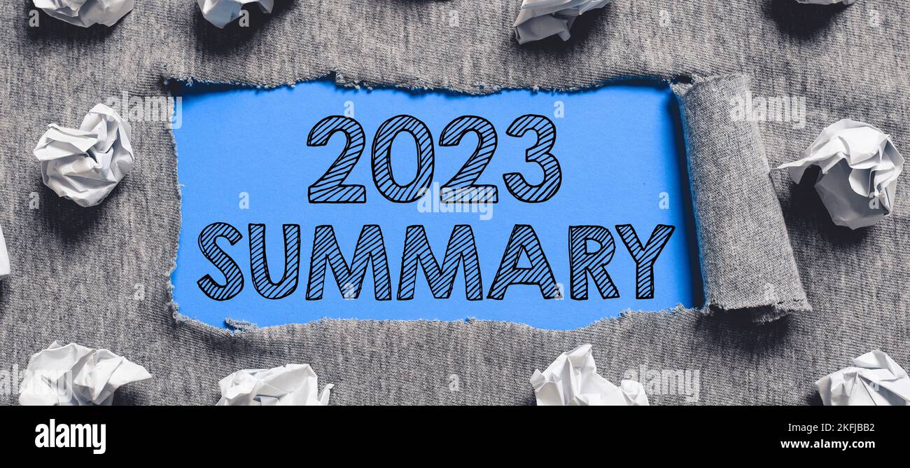 Sign displaying 2023 Summary. Business overview summarizing past year ...