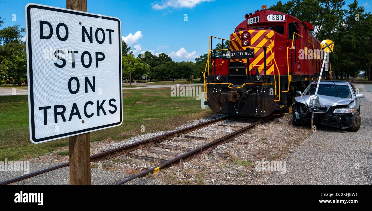 A U.S. Army Train and a damaged car are used as displays next to a ...