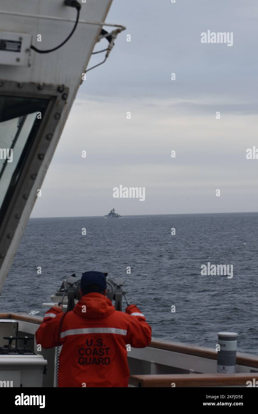 A Coast Guard Cutter Kimball crewmember observing a foreign vessel in ...