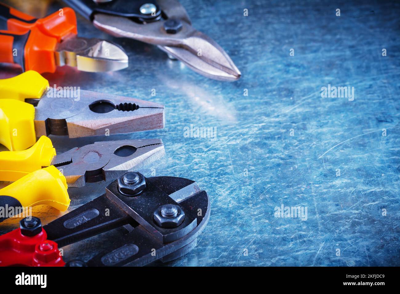 Bolt cutter tin snips pliers nippers on scratched vintage metallic ...