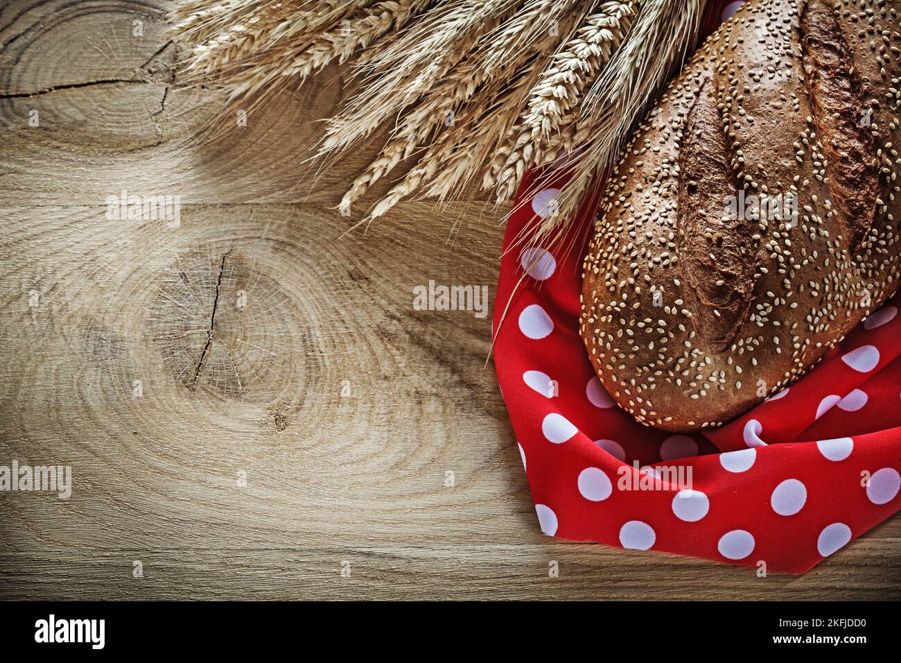 Bread wheat ears red polka-dot napkin on wooden board Stock Photo - Alamy