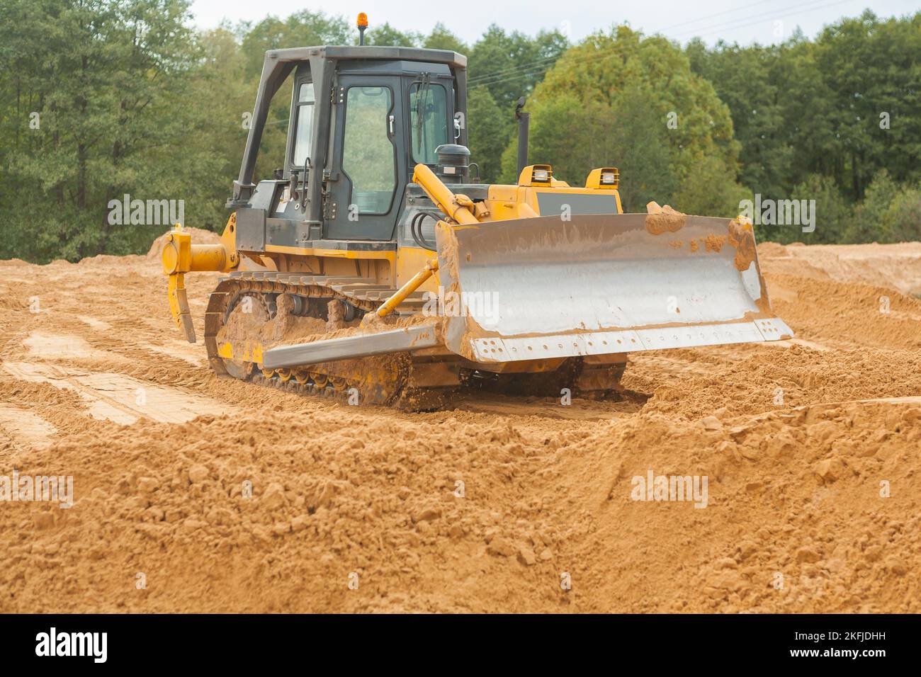 Bulldozer on sand Stock Photo - Alamy