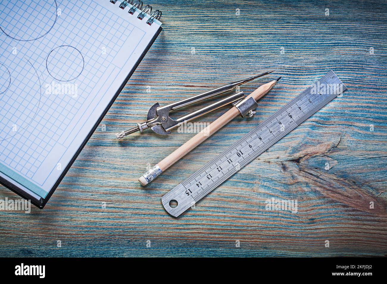 Checked copybook ruler divider pencil on vintage wood board Stock Photo ...