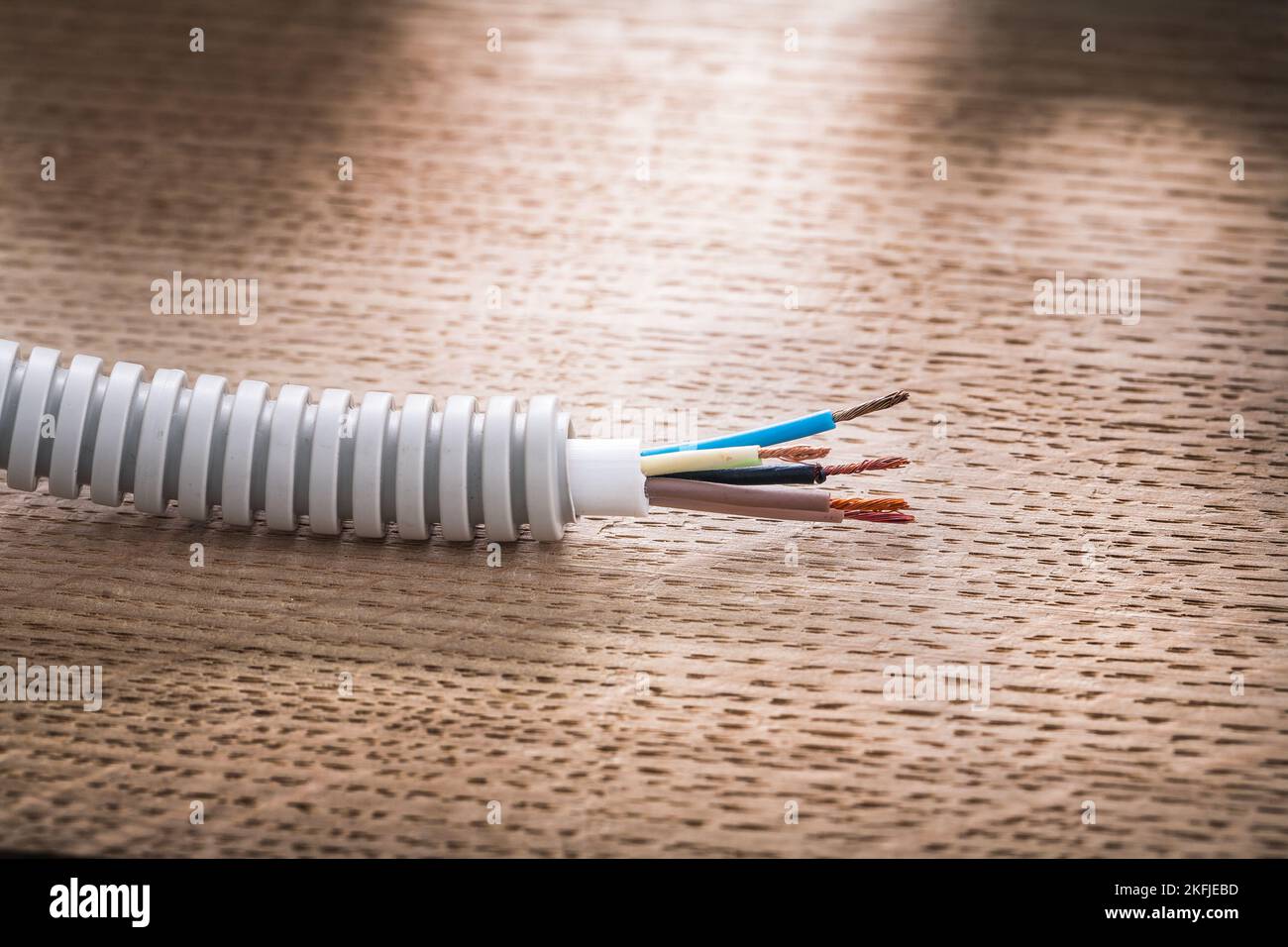 Electric cable in corrugated pipe Stock Photo - Alamy