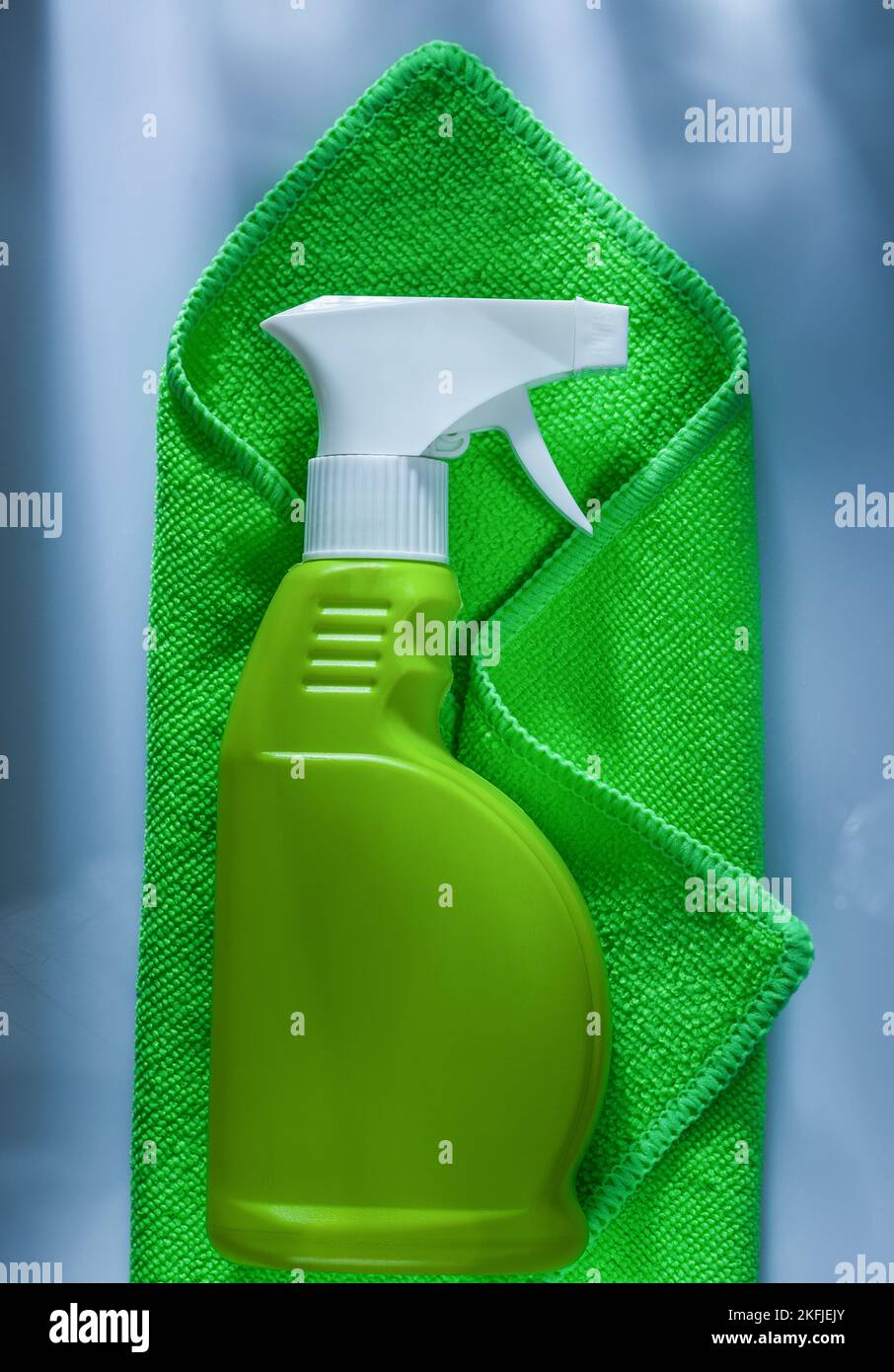 Green washing rag sprayer on white background Stock Photo - Alamy