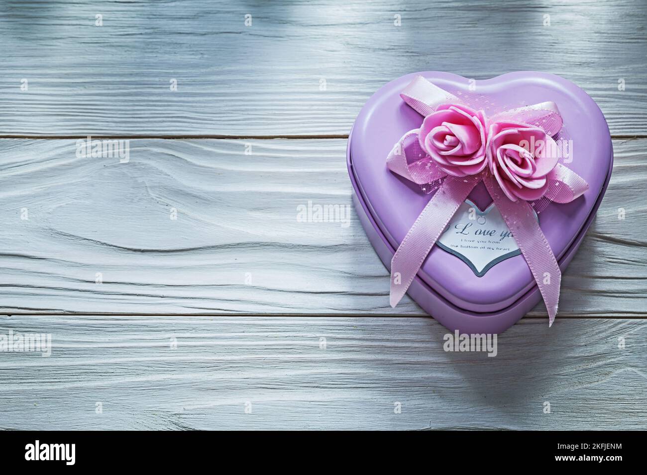 Heart-shaped present box on wooden board holidays concept Stock Photo ...