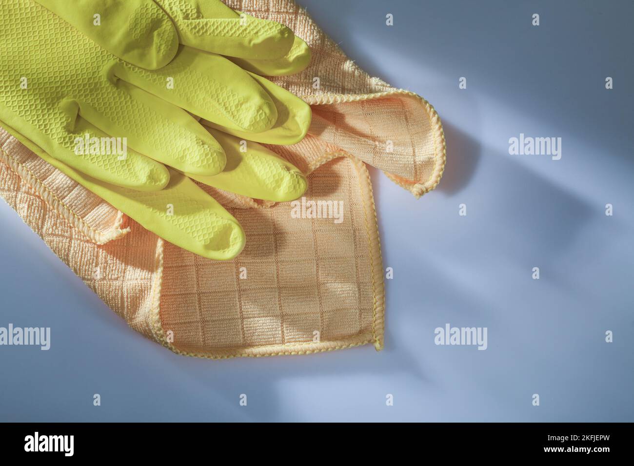 Household dishrag protective gloves on white background Stock Photo - Alamy