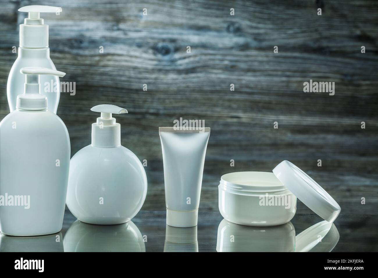 higiene products white plasic pump dispensers tube and jar cream on ...