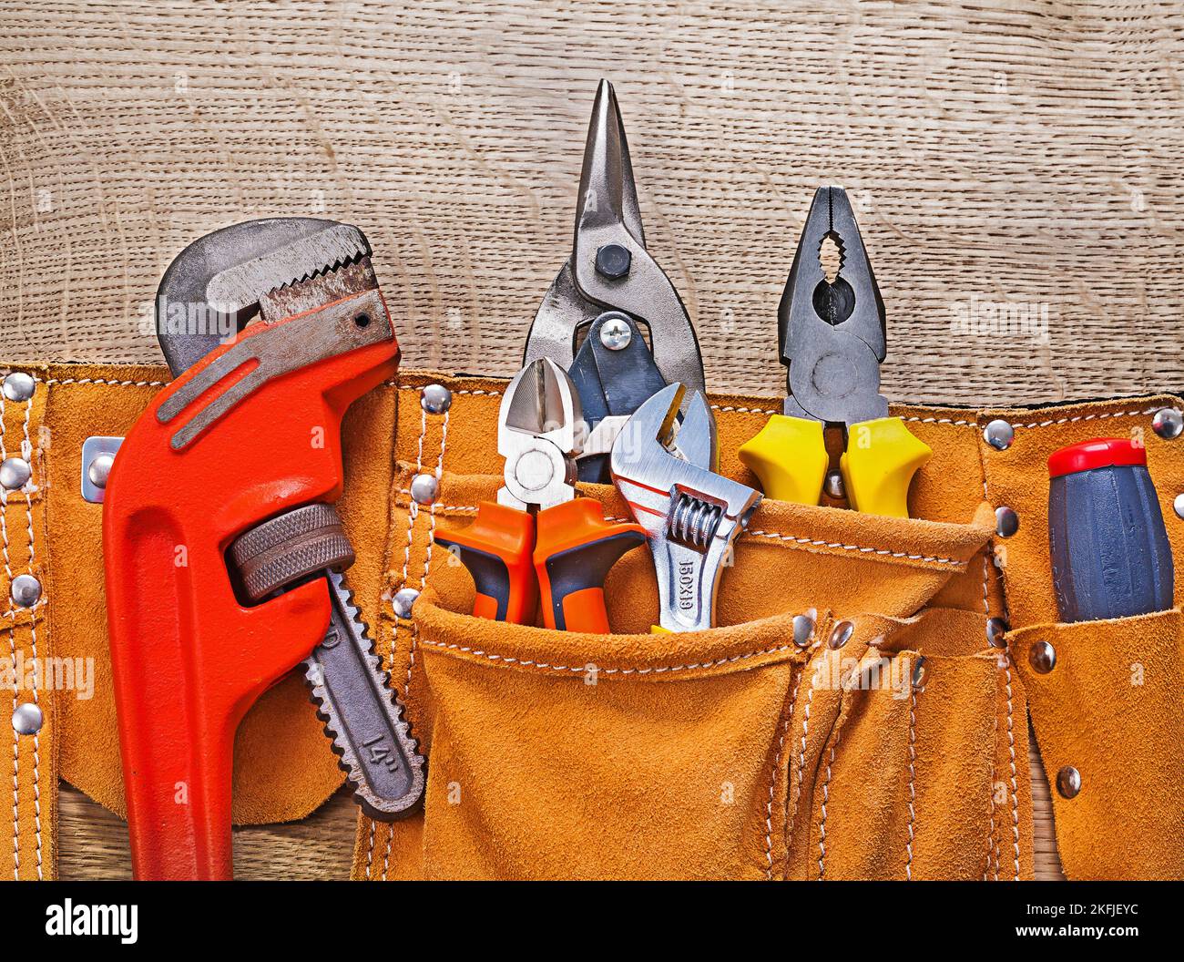 Leather toolbelt with construction tools on wood board Stock Photo - Alamy