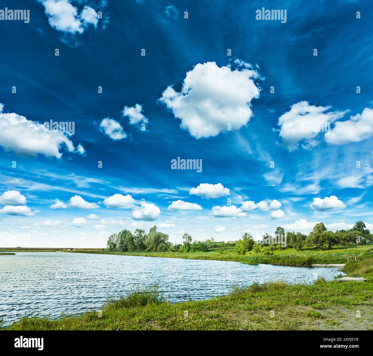lake in spring with beautiful cloudy sky Stock Photo - Alamy
