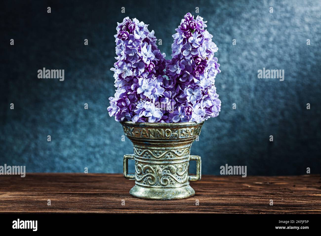lilac flowers in vintage bronze bowl on black background Stock Photo ...