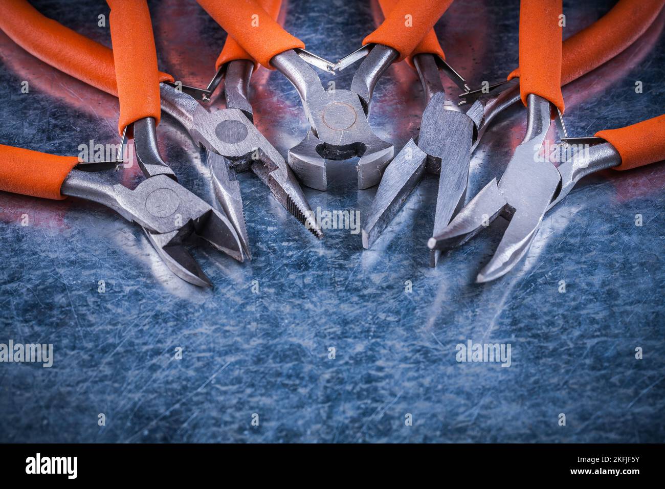 Metal insulated electric pliers nippers close up view electricity ...