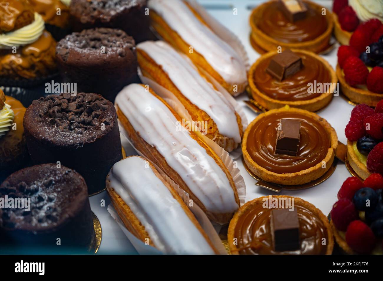 Assortment of french fresh baked sweet pastry with fresh fruits and ...