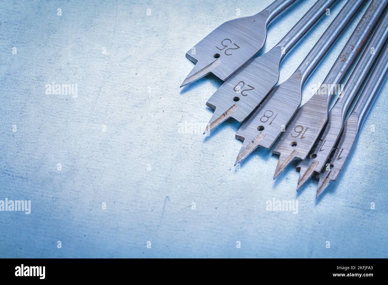 Metal spade bits for drilling wood on metallic background construction ...