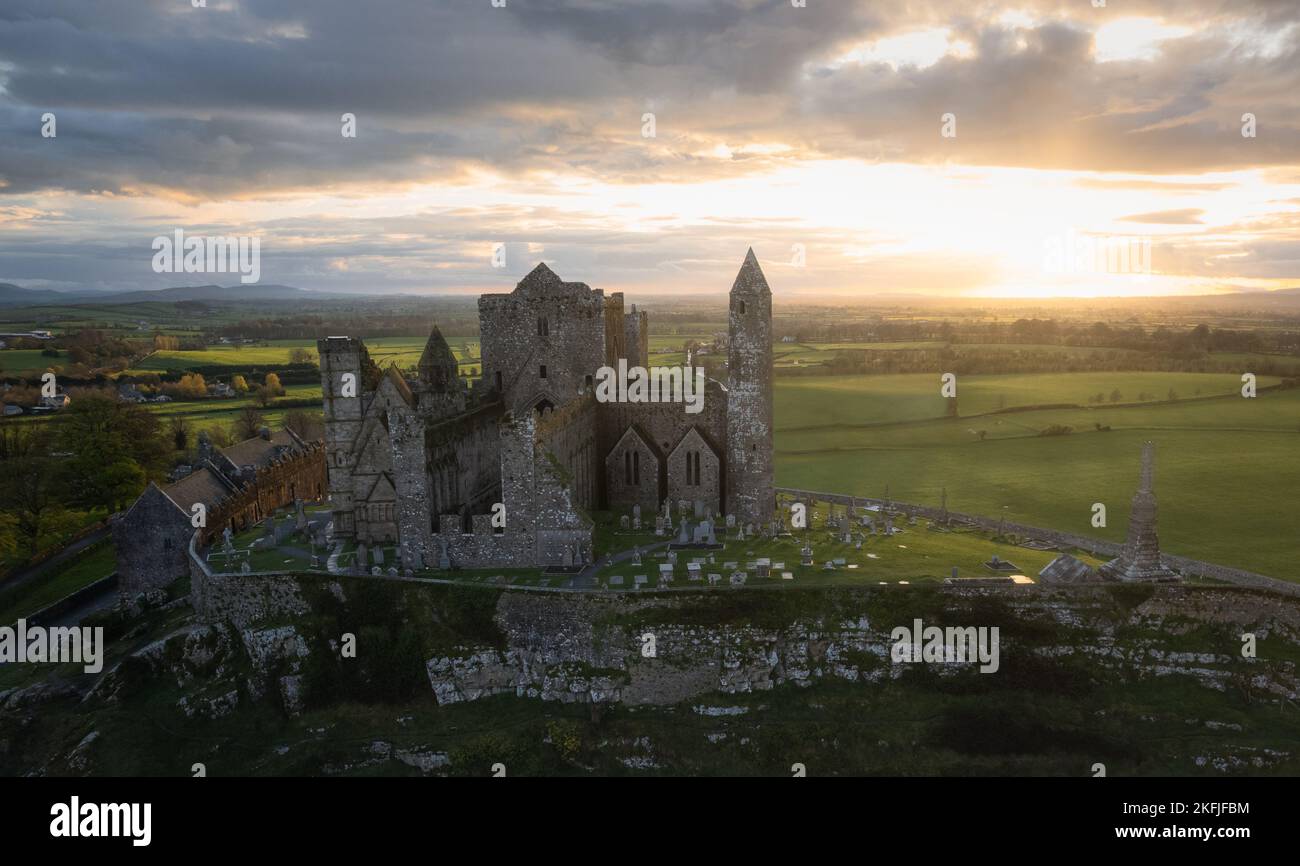 An aerial view of the sunrise over the Rock of Cashel castle in county ...