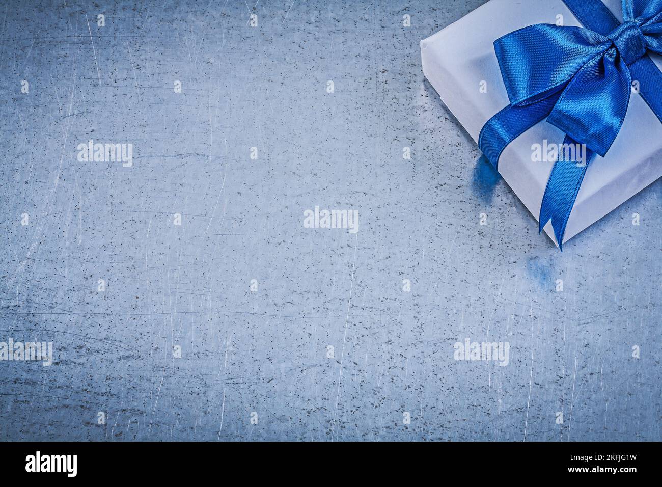 Present box blue bow on metallic background copyspace celebrations ...