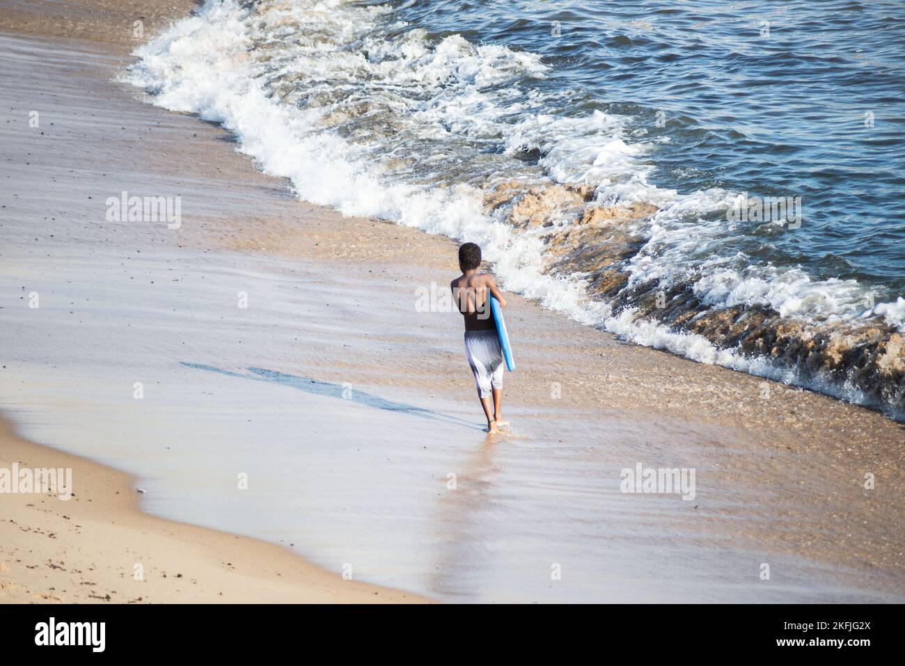 Surfer surfboard wetsuit entering hi-res stock photography and images ...