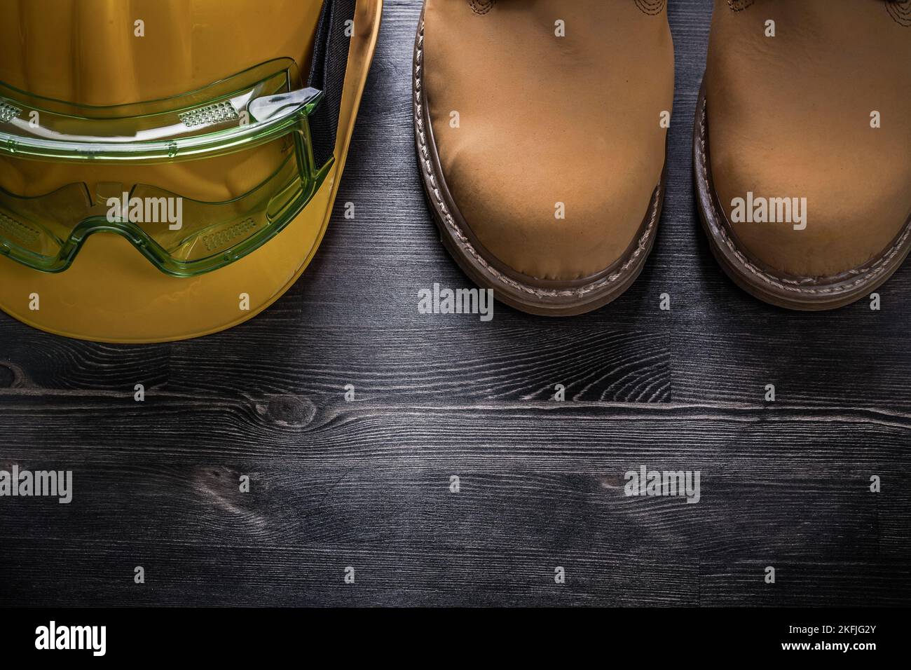 Protective goggles hard hat safety boots on wood board Stock Photo - Alamy