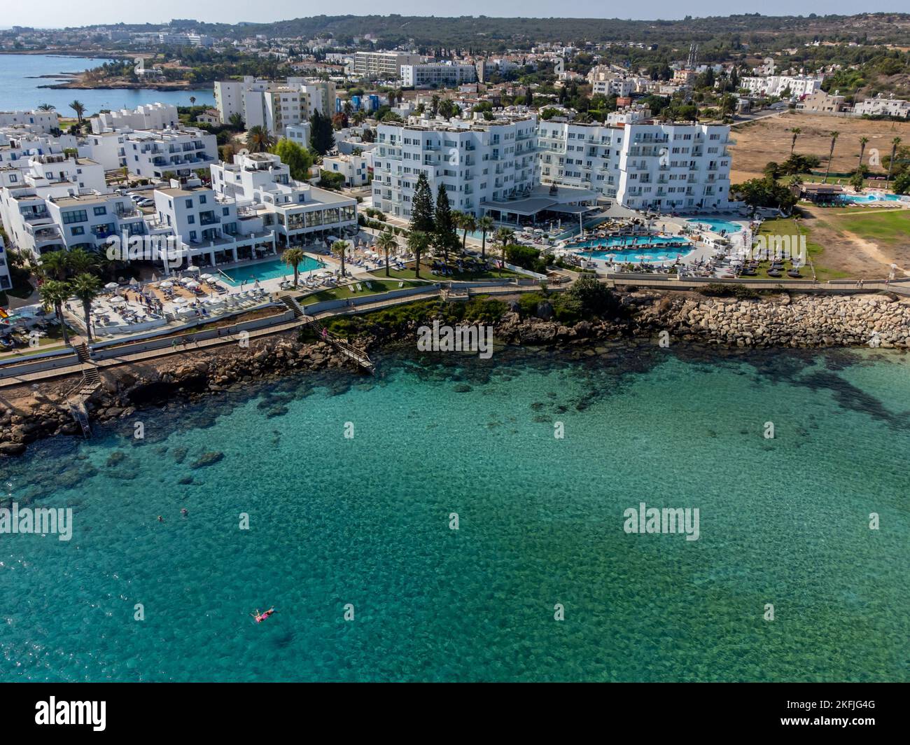 Aerial panoramic view on villas and holidays resorts and blue crystal ...