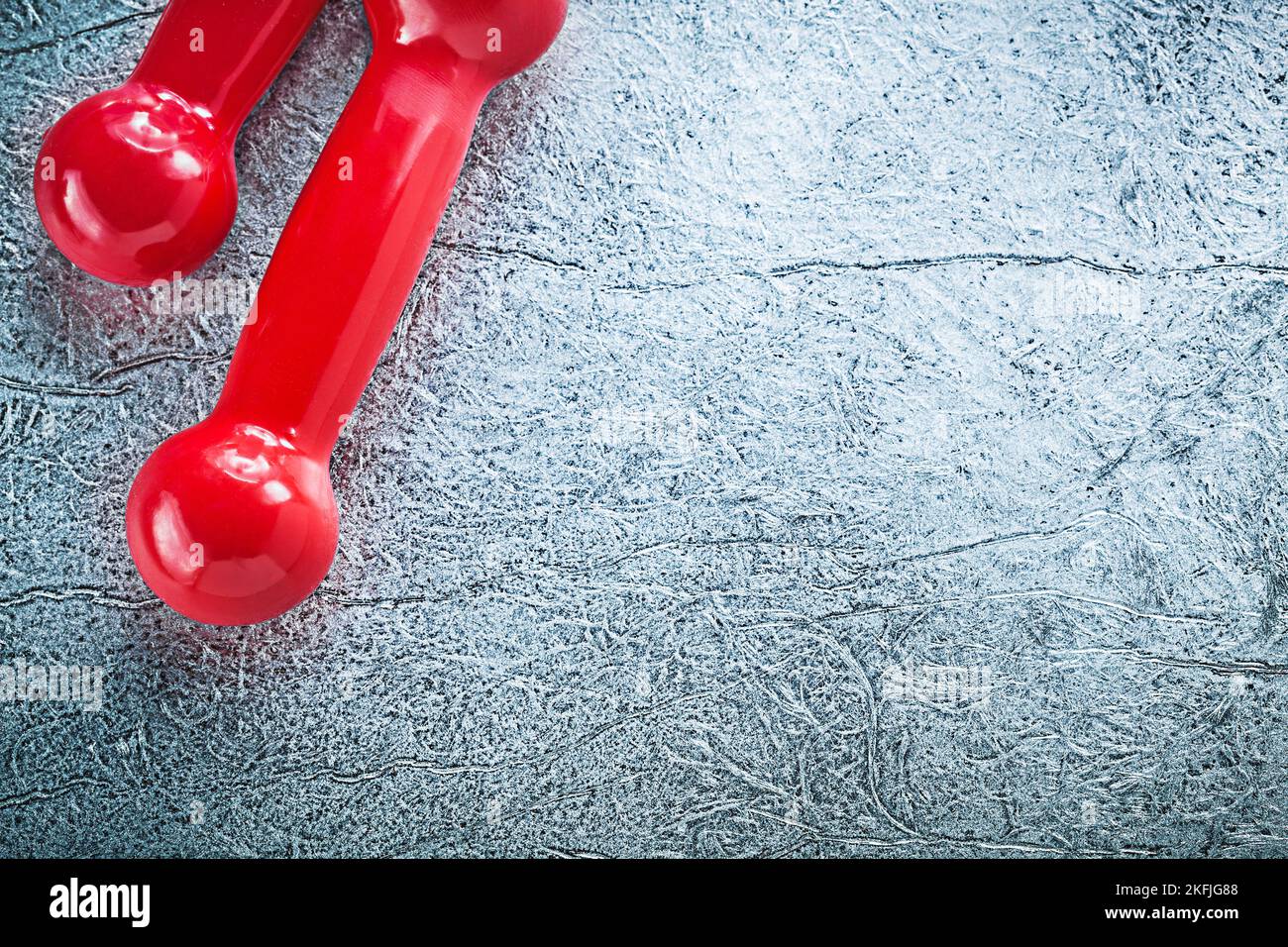Red dumbbell weights on silver background sports training concept Stock ...