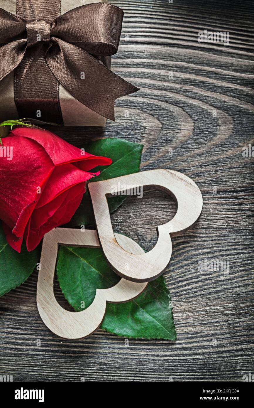 Red rose hearts packed gift box on wooden board holidays concept Stock ...