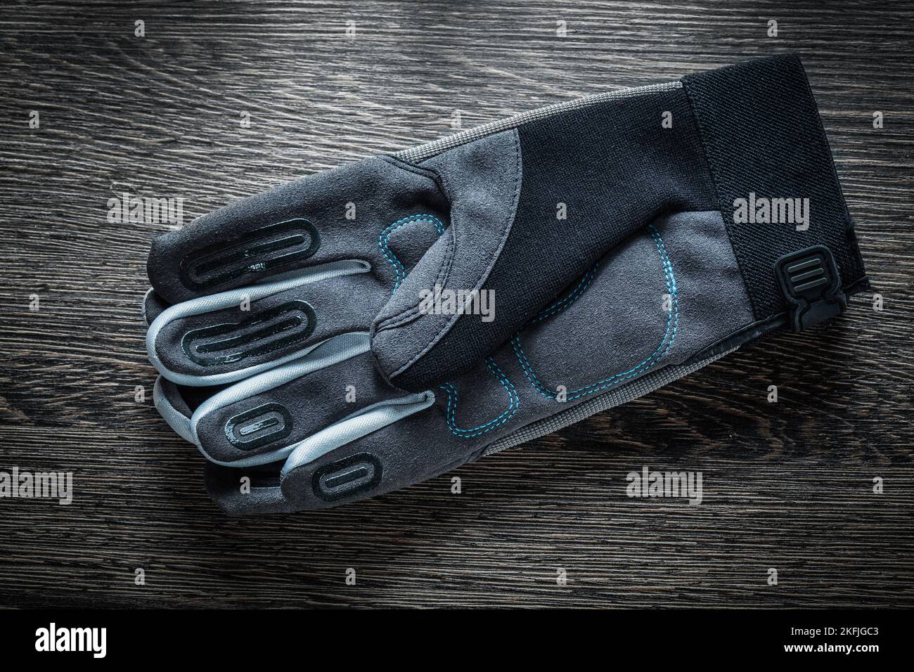 Safety gloves on wooden board Stock Photo - Alamy