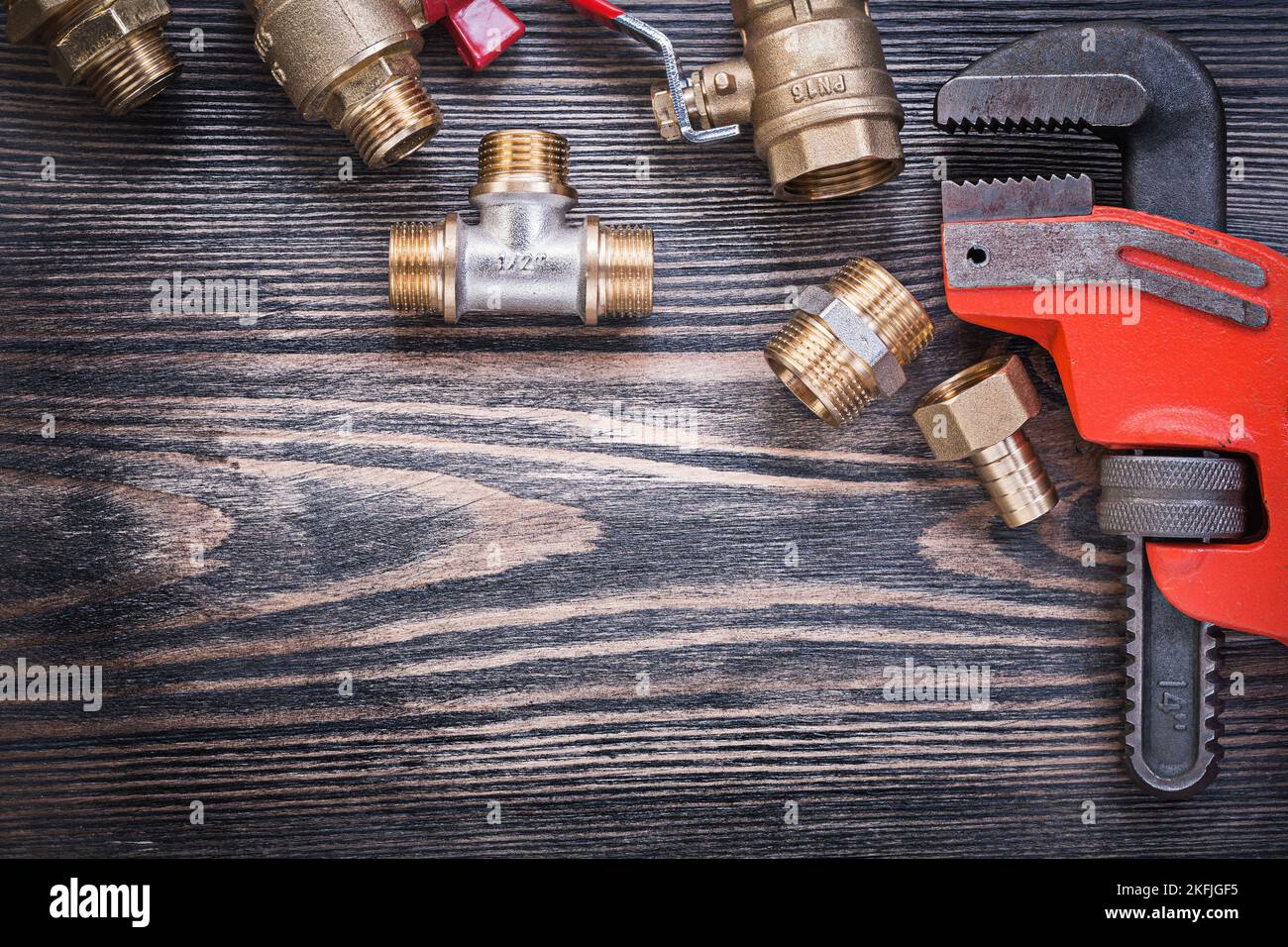 Set of plumbers tools on wooden board plumbing concept Stock Photo - Alamy